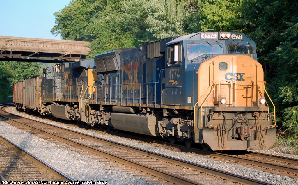 E877-10 with CSXT 4774 (SD70MAC) & CSXT 589 (AC44CW) off the Old Main Line dropping coal from ...